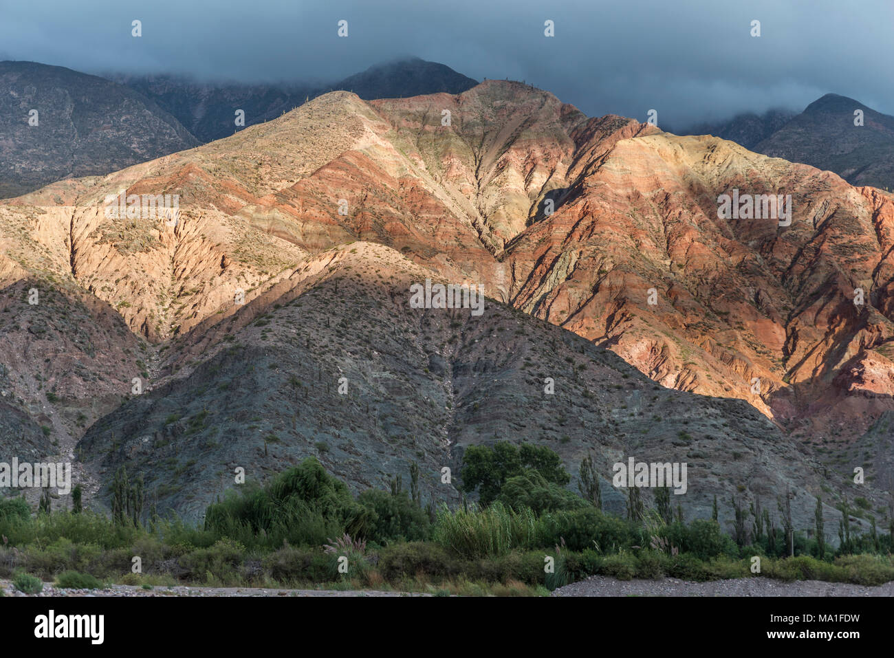 view of the mountains of the Quebrada de Humahuaca with sun and shadows ...