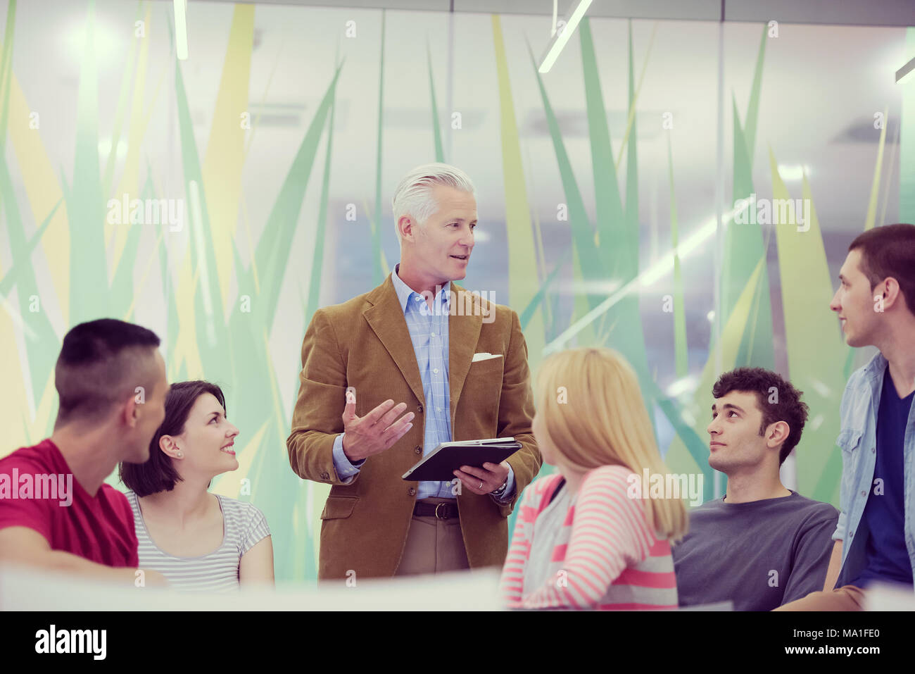 group of students study with professor in modern school classroom Stock ...