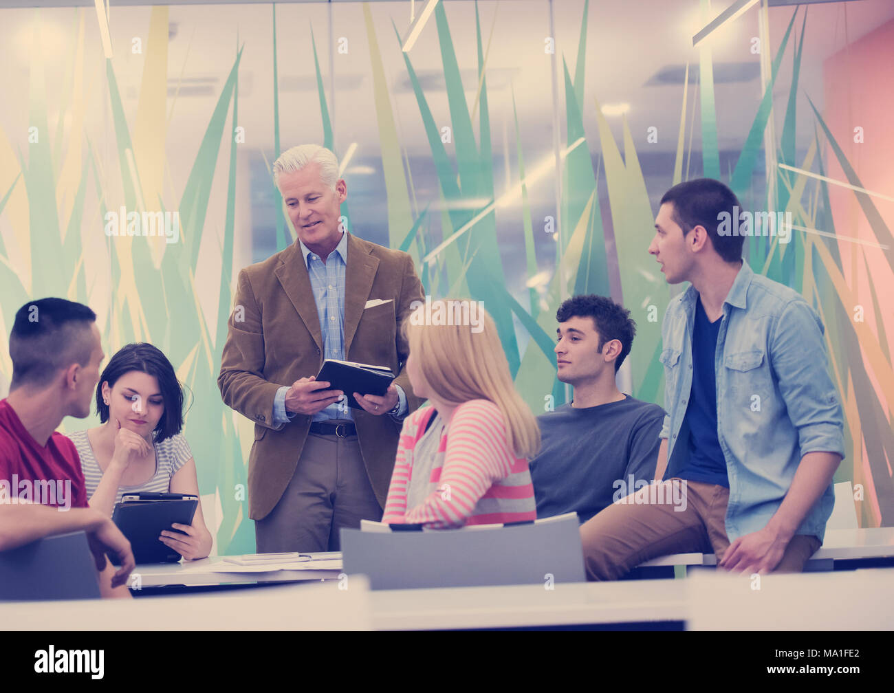 group of students study with professor in modern school classroom Stock ...