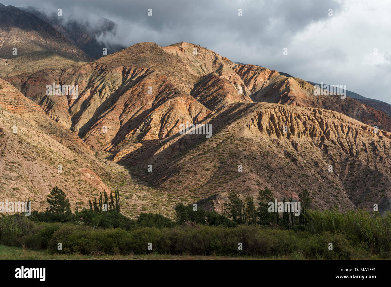 view of the mountains of the Quebrada de Humahuaca with sun and shadows ...