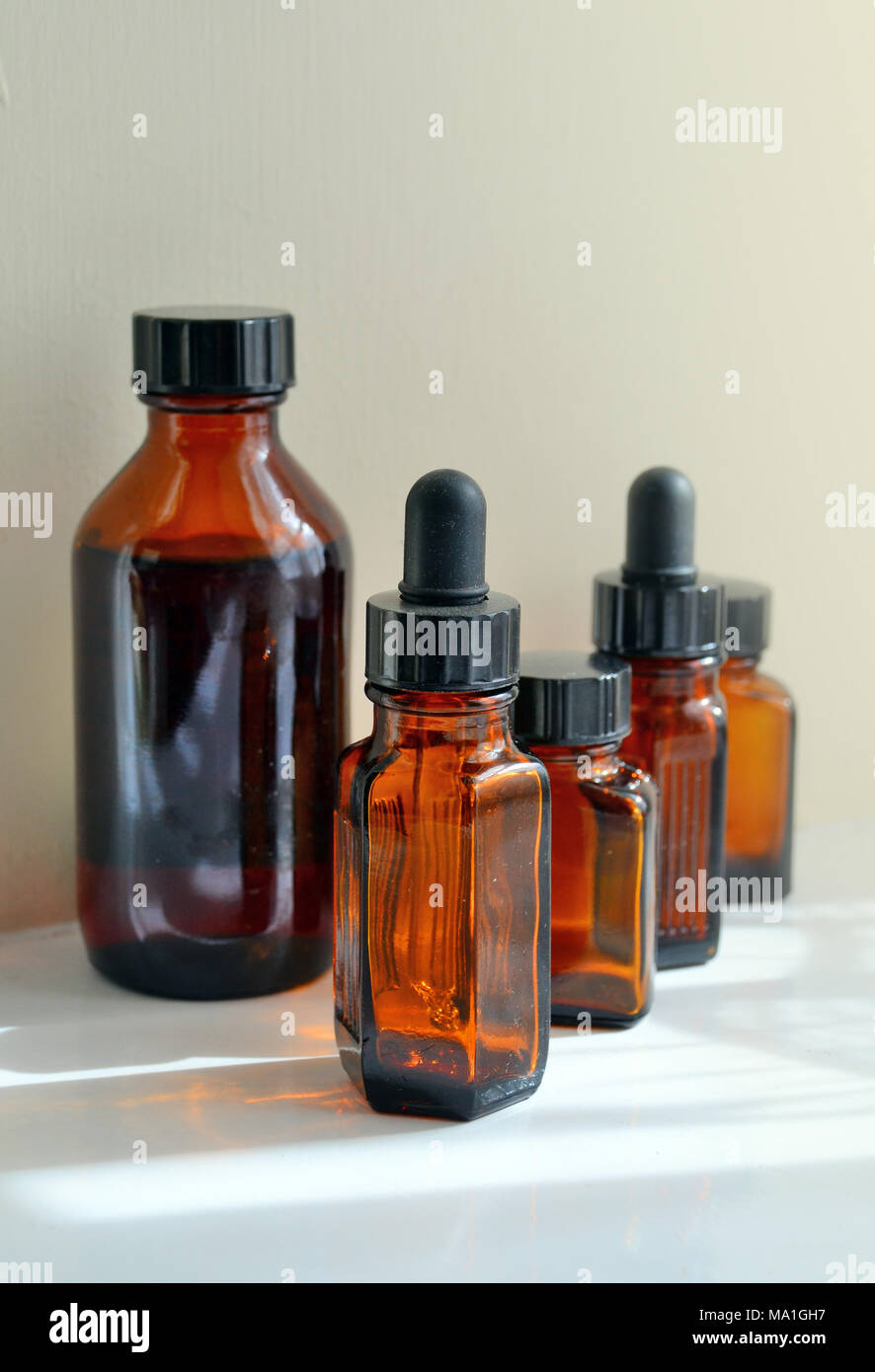 Various sizes of brown / amber medicinal bottles, including some with ...