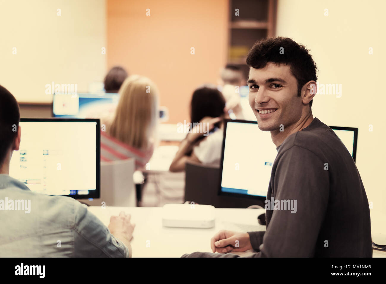 technology students group in computer lab school classroom working on ...