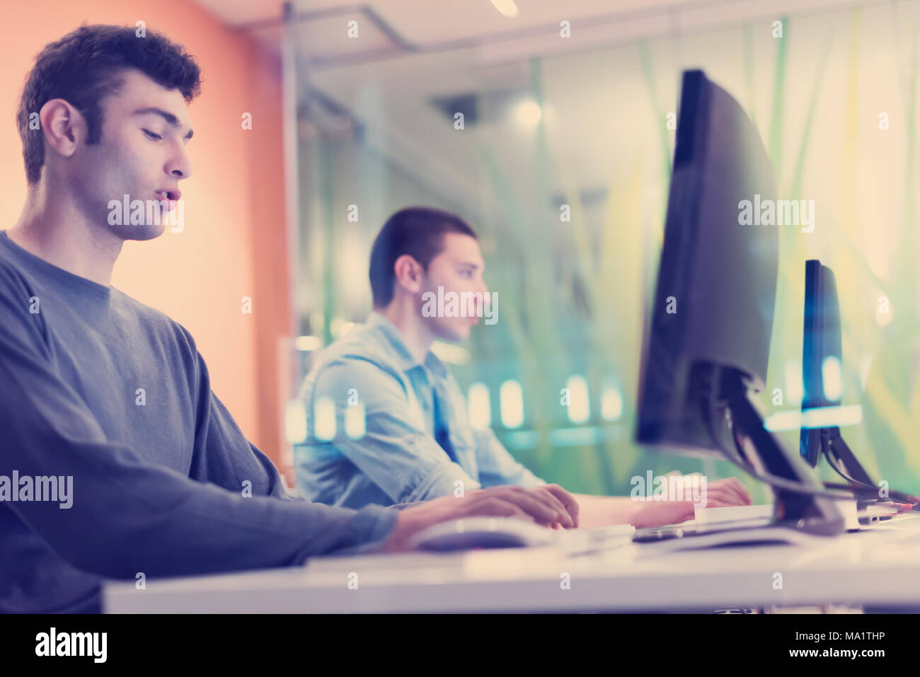 technology students group in computer lab school classroom working on ...