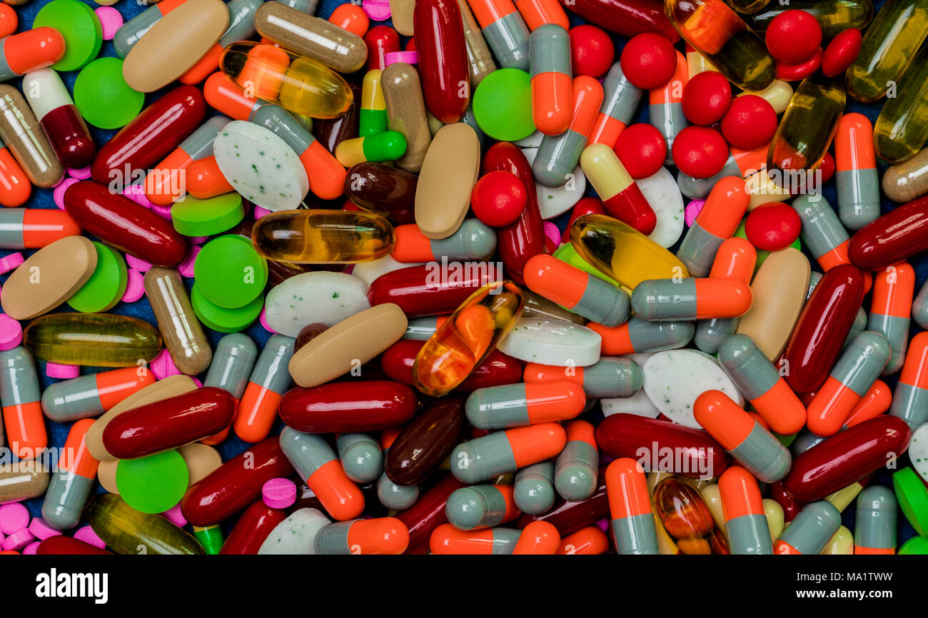 Pile of colorful tablets and capsule pills. Full frame of medicine ...
