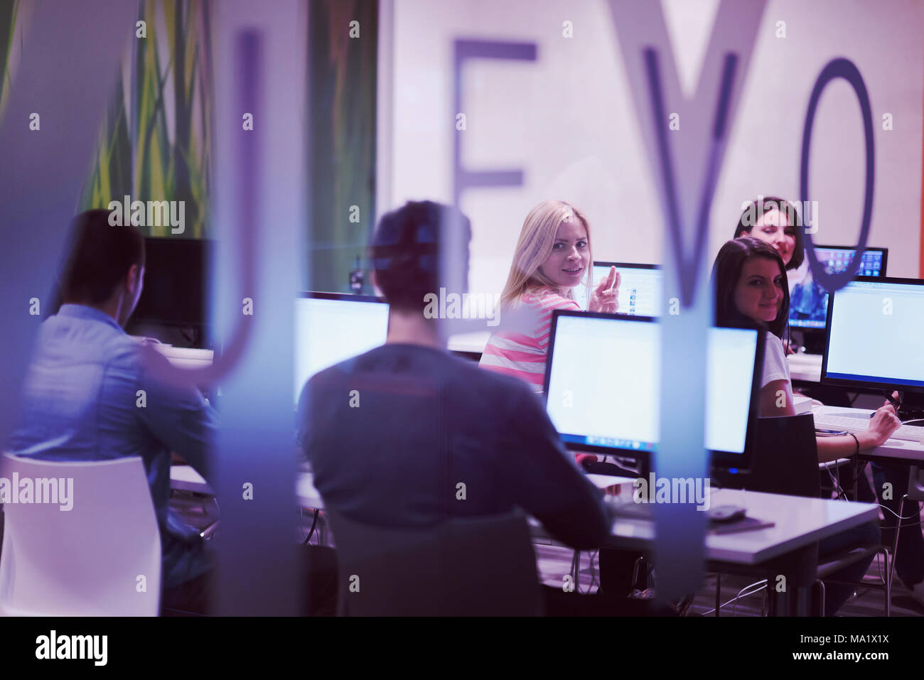 technology students group in computer lab school classroom working on ...