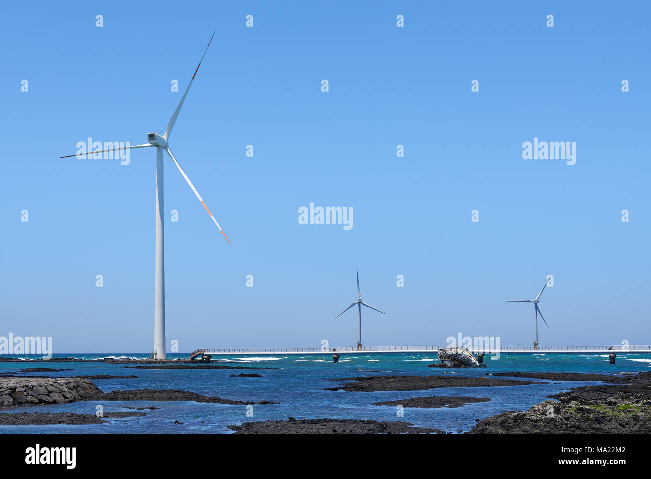 Sinchang windmill farm, coastal road with wind turbines located at ...