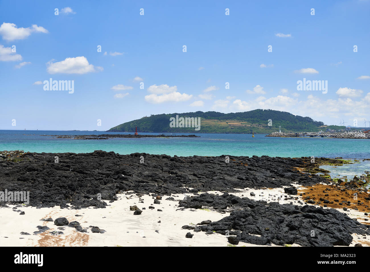 Hamdeok beach and Seoubong peak in Jeju, Korea. Hamdeok Beach is famous ...