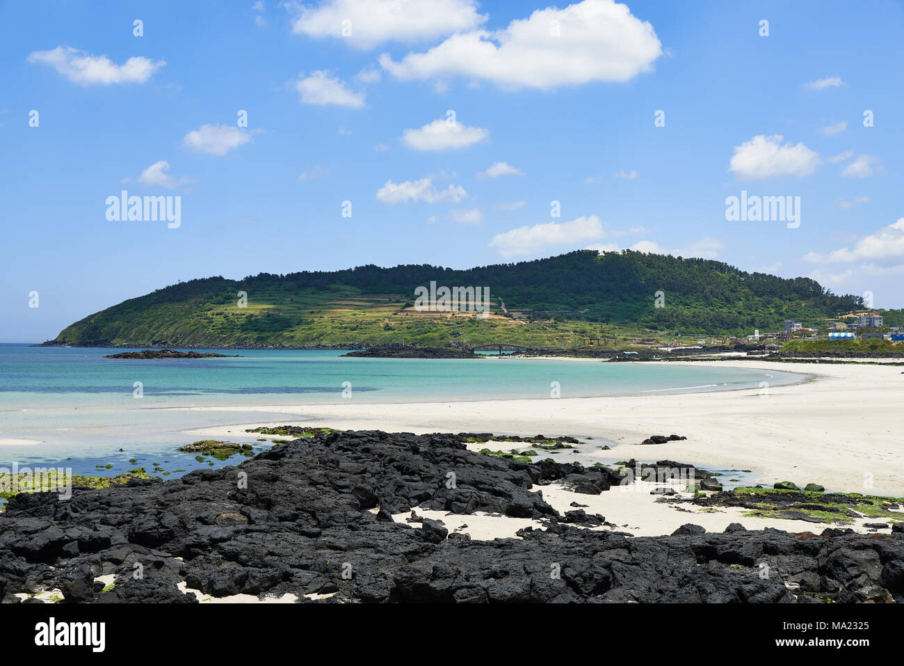 Hamdeok beach and Seoubong peak in Jeju, Korea. Hamdeok Beach is famous ...