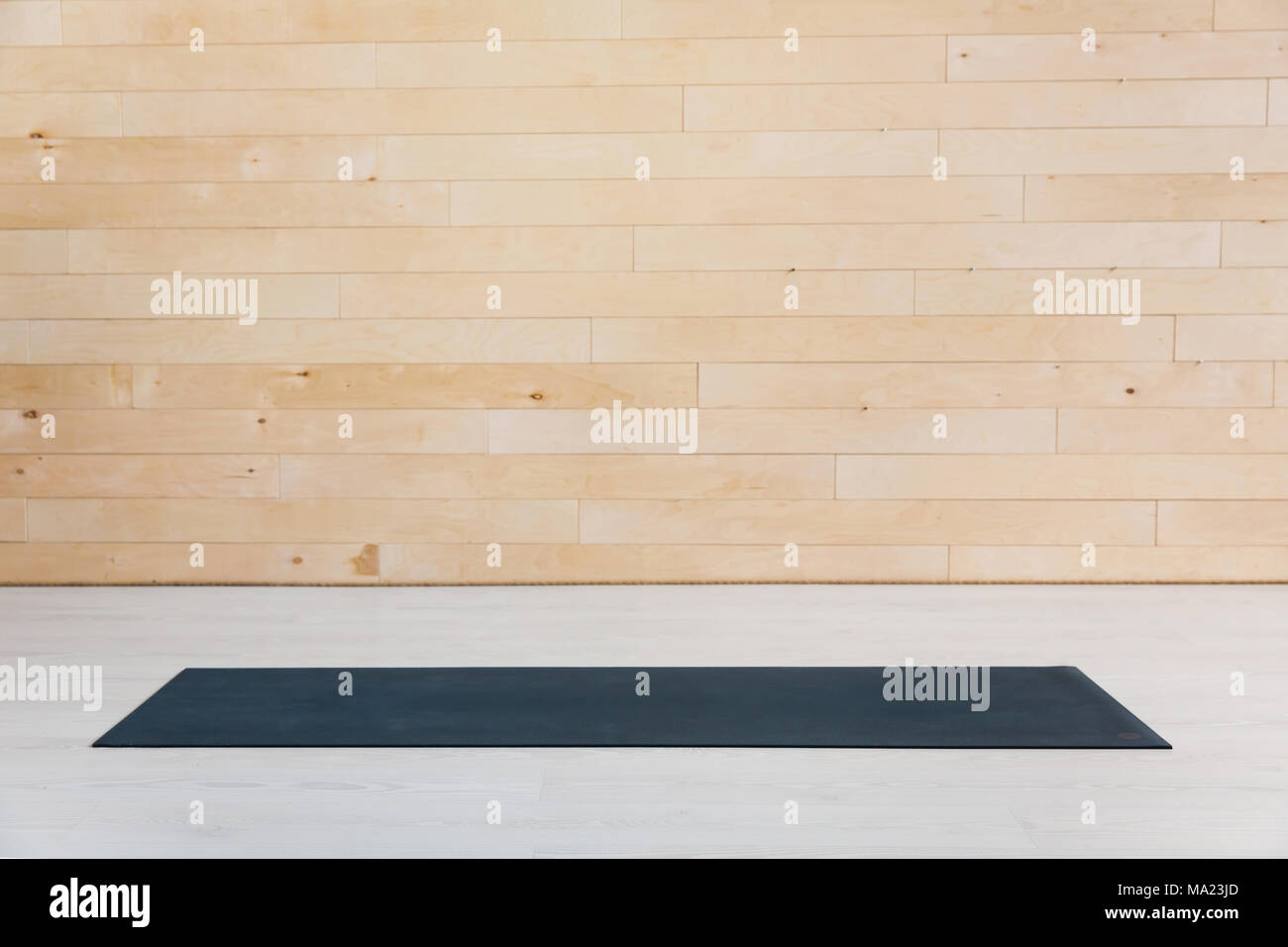 Empty yoga mat on the floor Stock Photo - Alamy