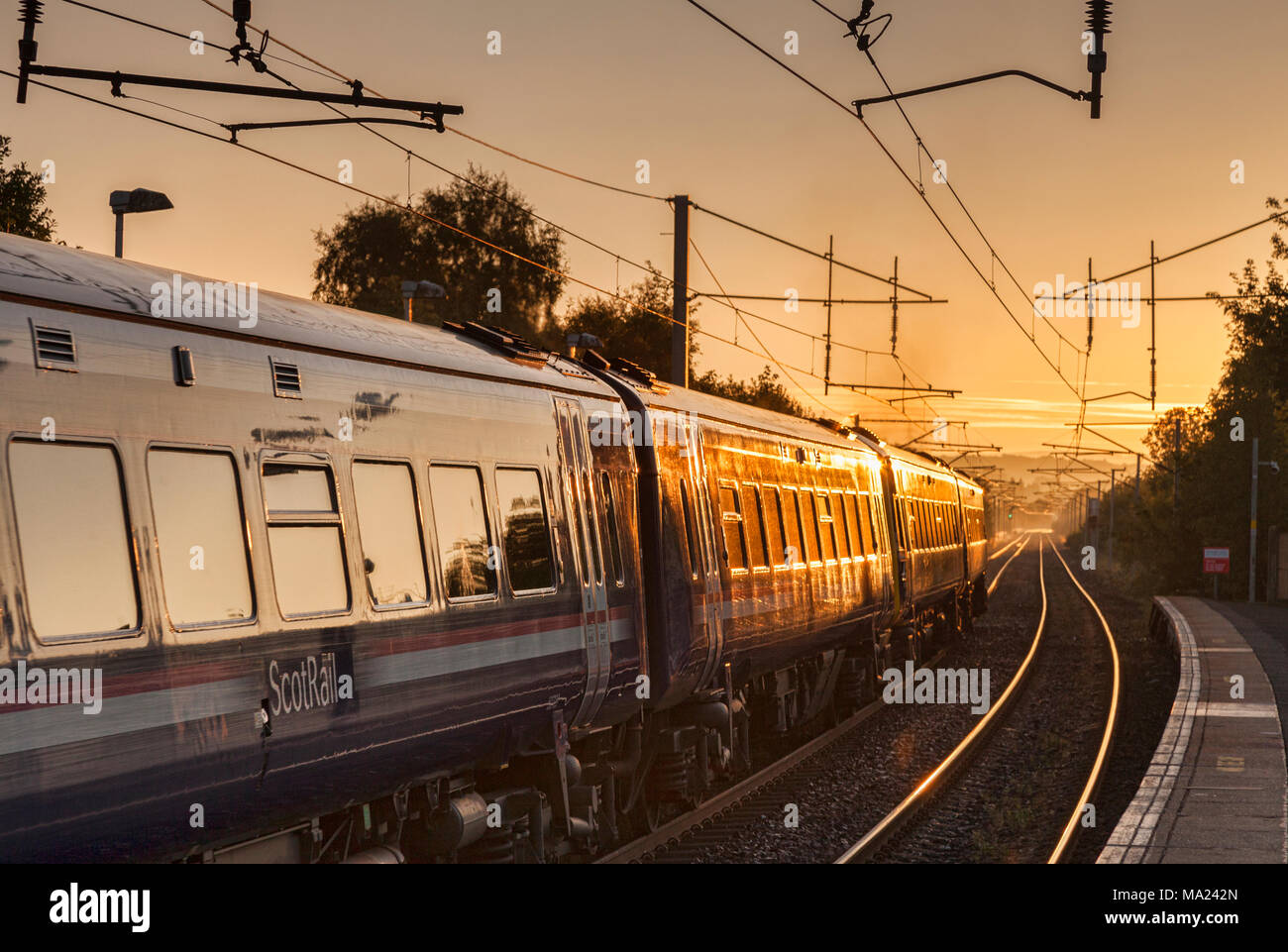 ScotRail train at station, early morning Stock Photo - Alamy