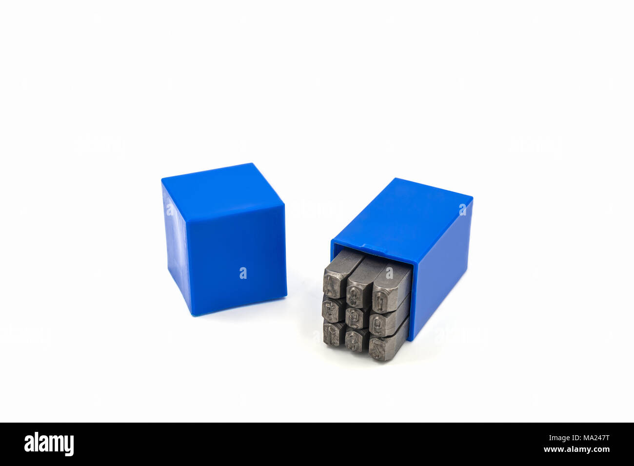 The metal lettering stamps punch set in a plastic box on the white ...