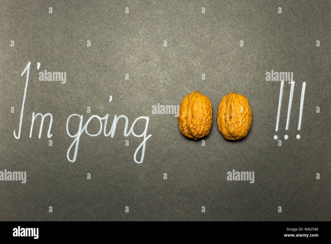 Concept of the phrase I'm going nuts with brown nuts and white hand ...