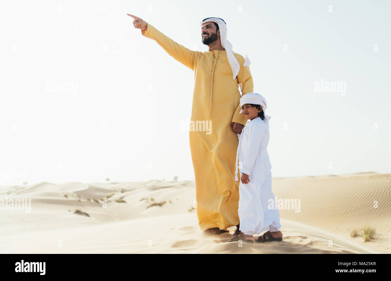 Father and son spending time in the desert Stock Photo - Alamy