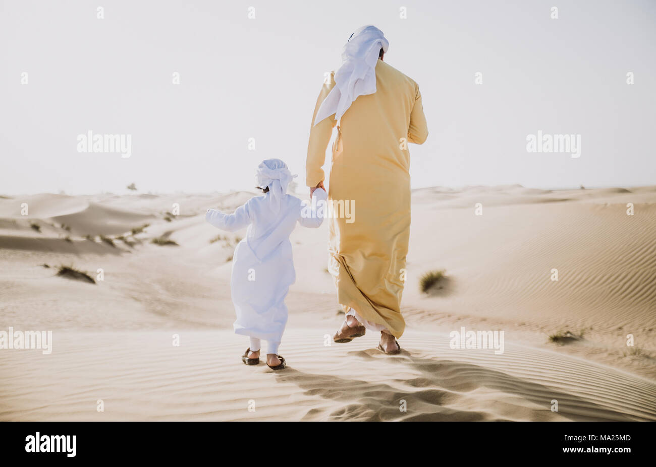 Father and son spending time in the desert Stock Photo - Alamy