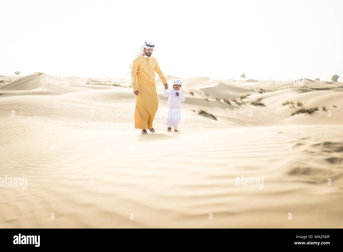 Father and son spending time in the desert Stock Photo - Alamy