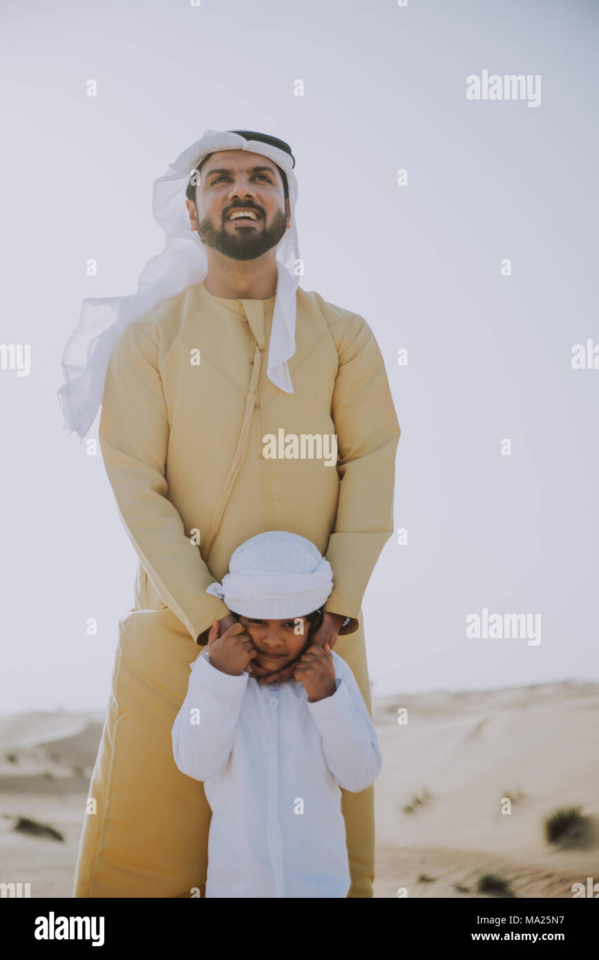 Father and son spending time in the desert Stock Photo - Alamy