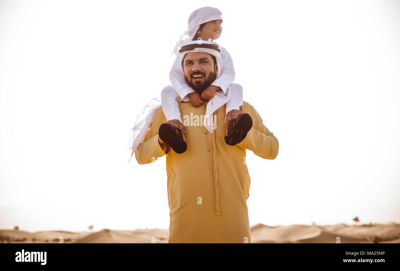 Father and son spending time in the desert Stock Photo - Alamy