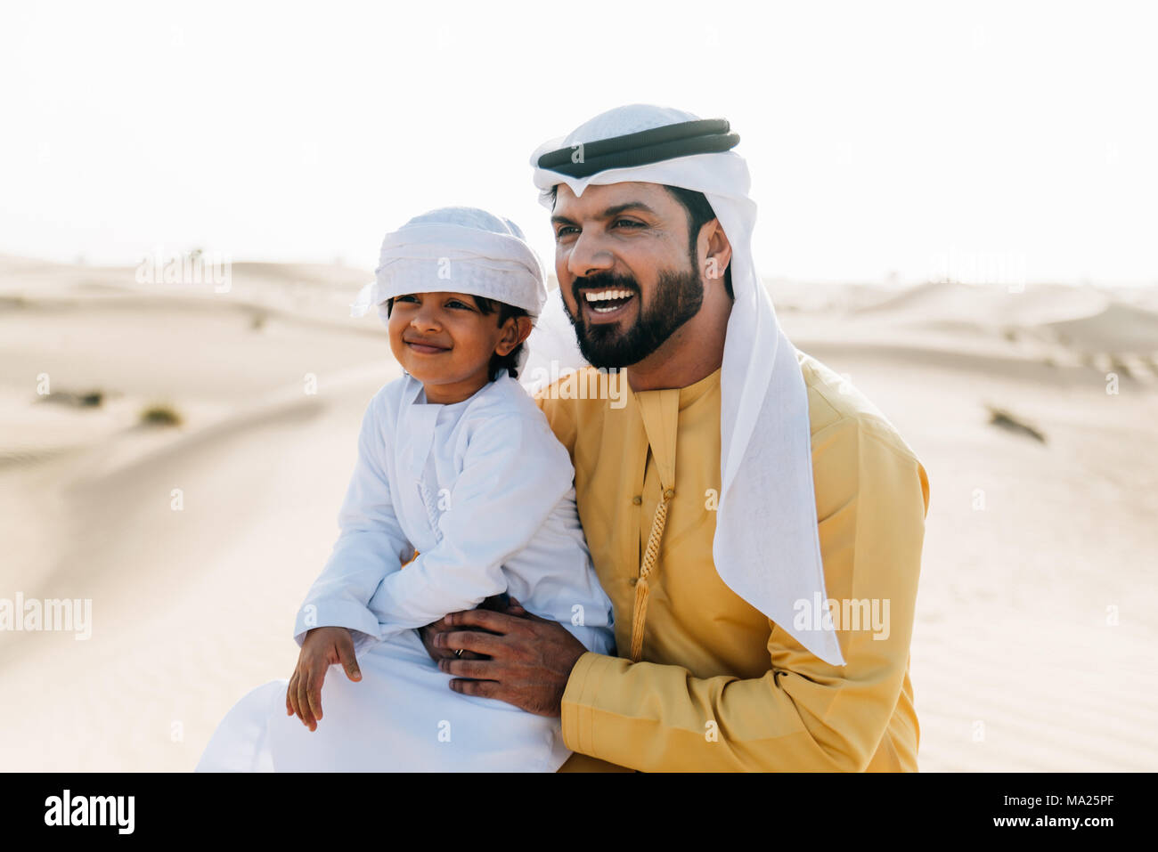 Father and son spending time in the desert Stock Photo - Alamy
