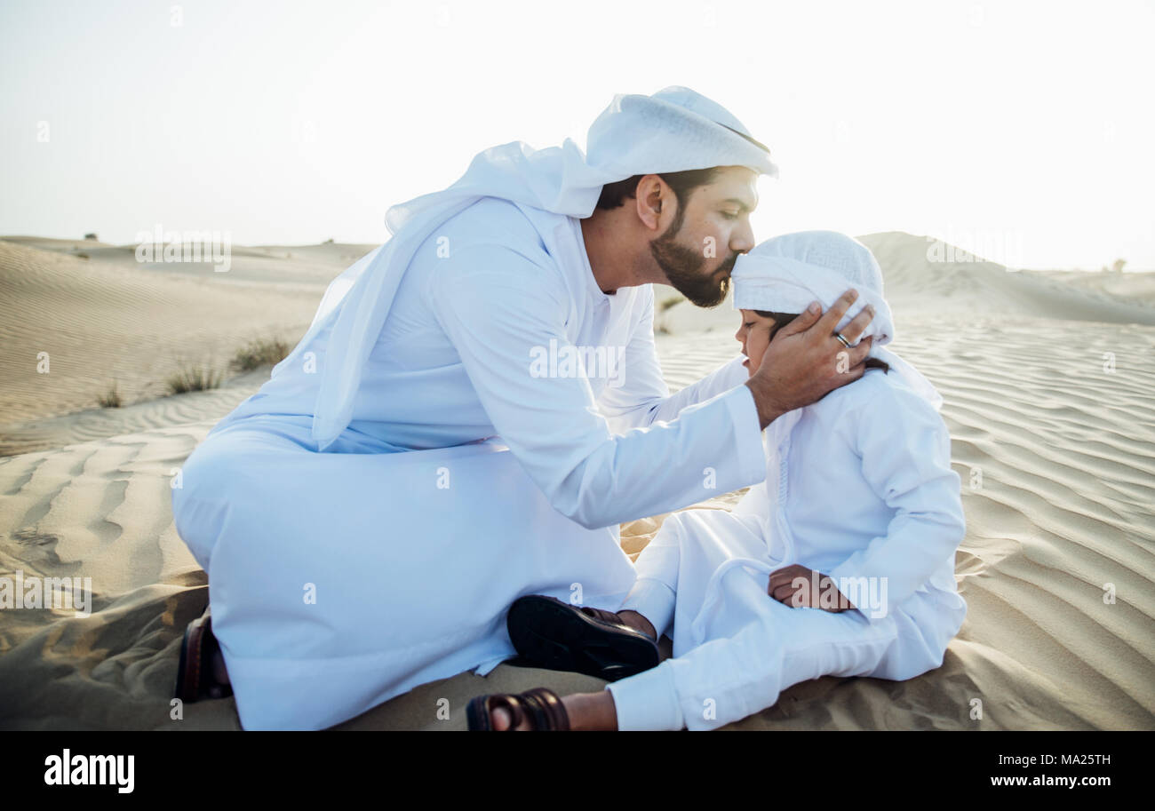 Father and son spending time in the desert Stock Photo - Alamy