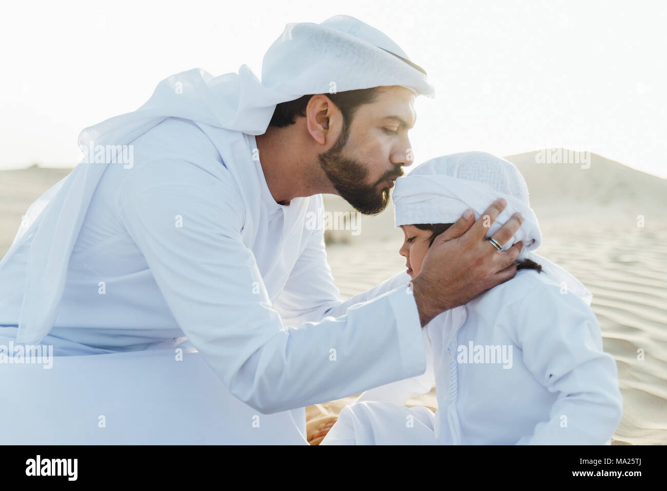 Father and son spending time in the desert Stock Photo - Alamy