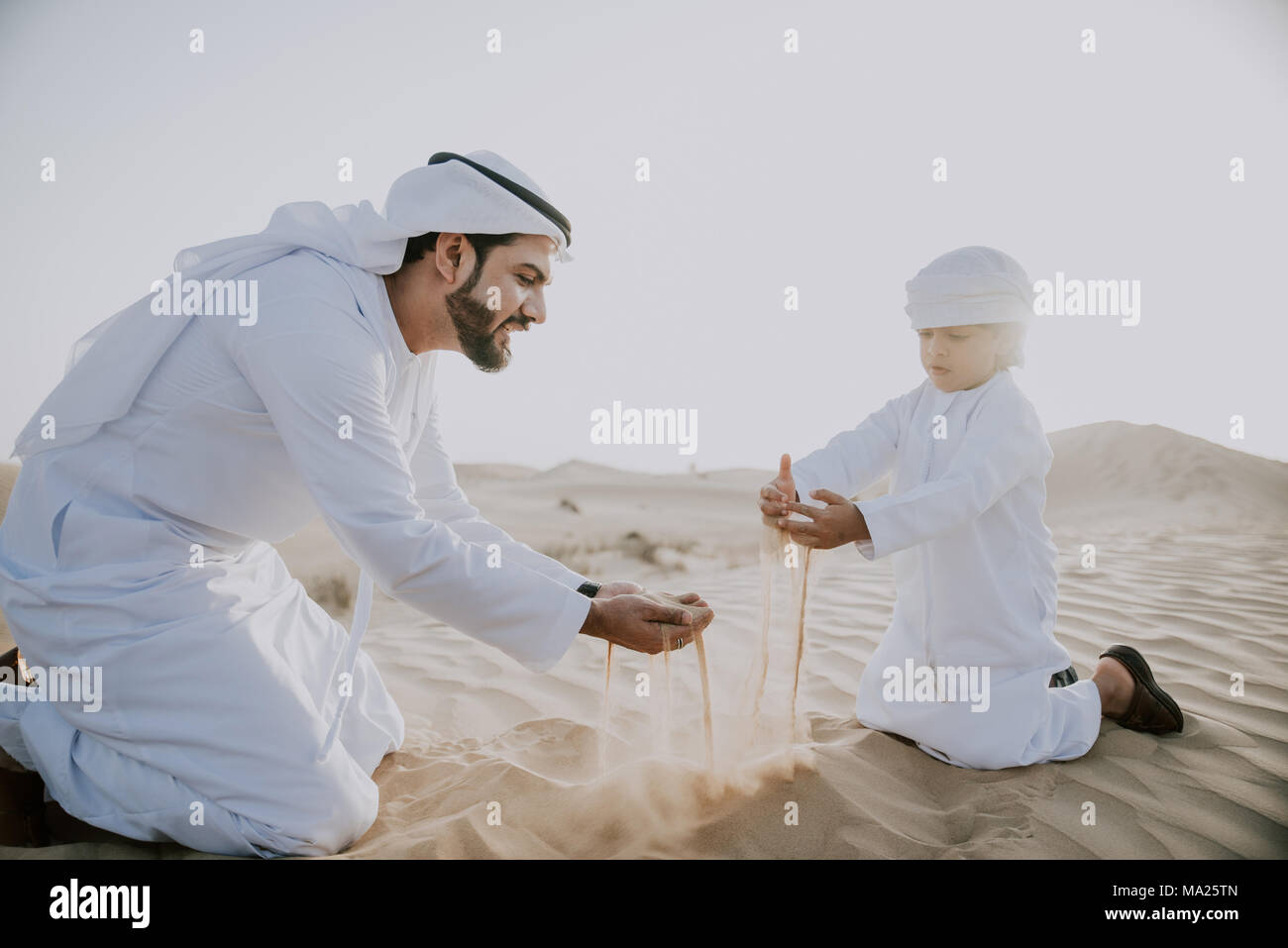 Father and son spending time in the desert Stock Photo - Alamy