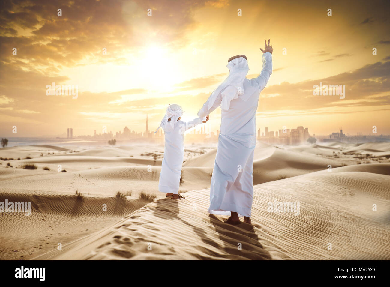 Father and son spending time in the desert Stock Photo - Alamy