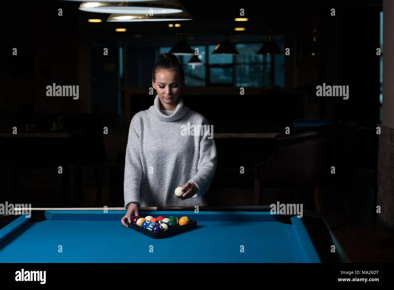 Portrait Of A Young Girl Playing Billiards Stock Photo - Alamy