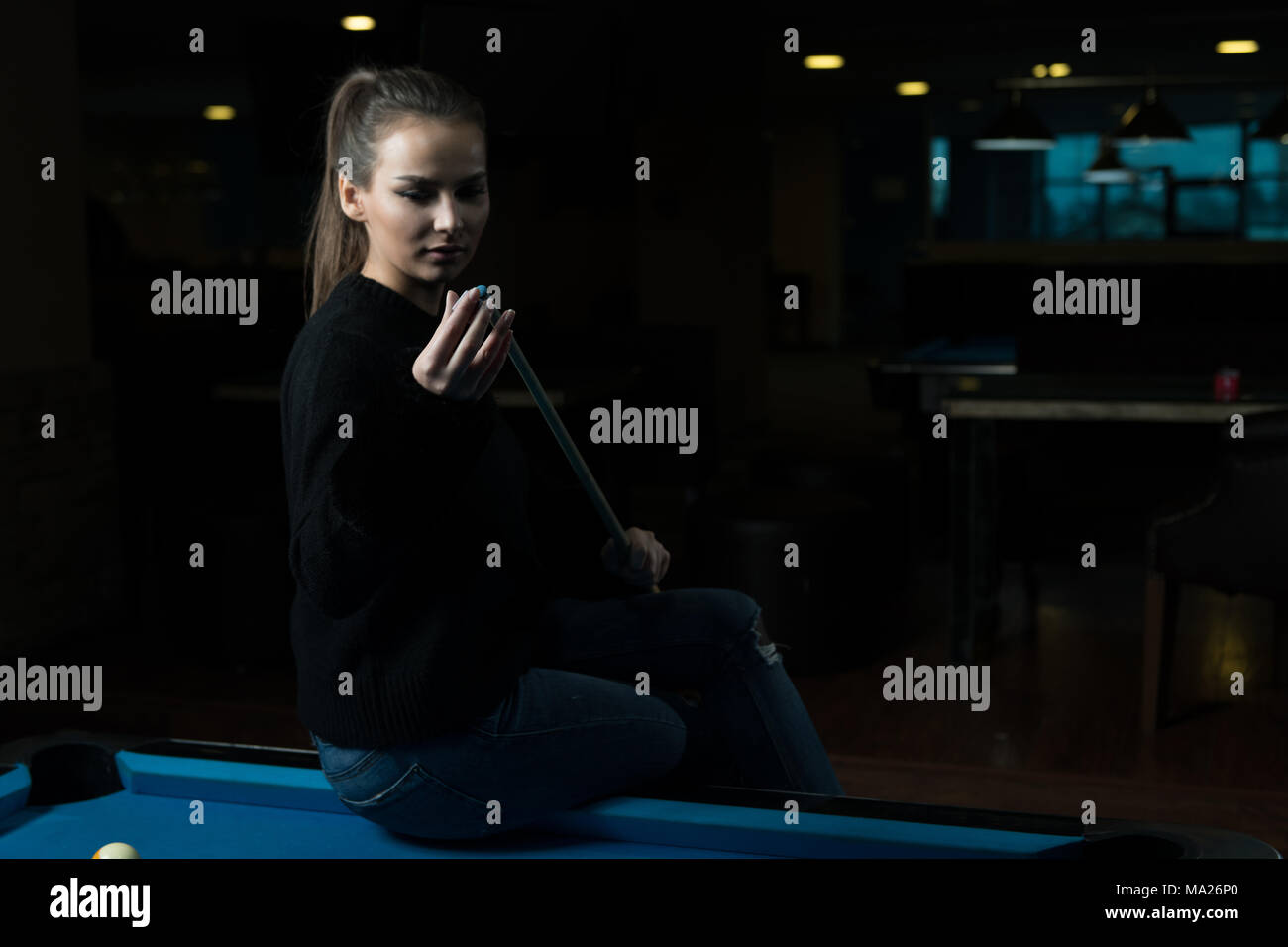 Portrait Of A Young Girl Playing Billiards Stock Photo - Alamy