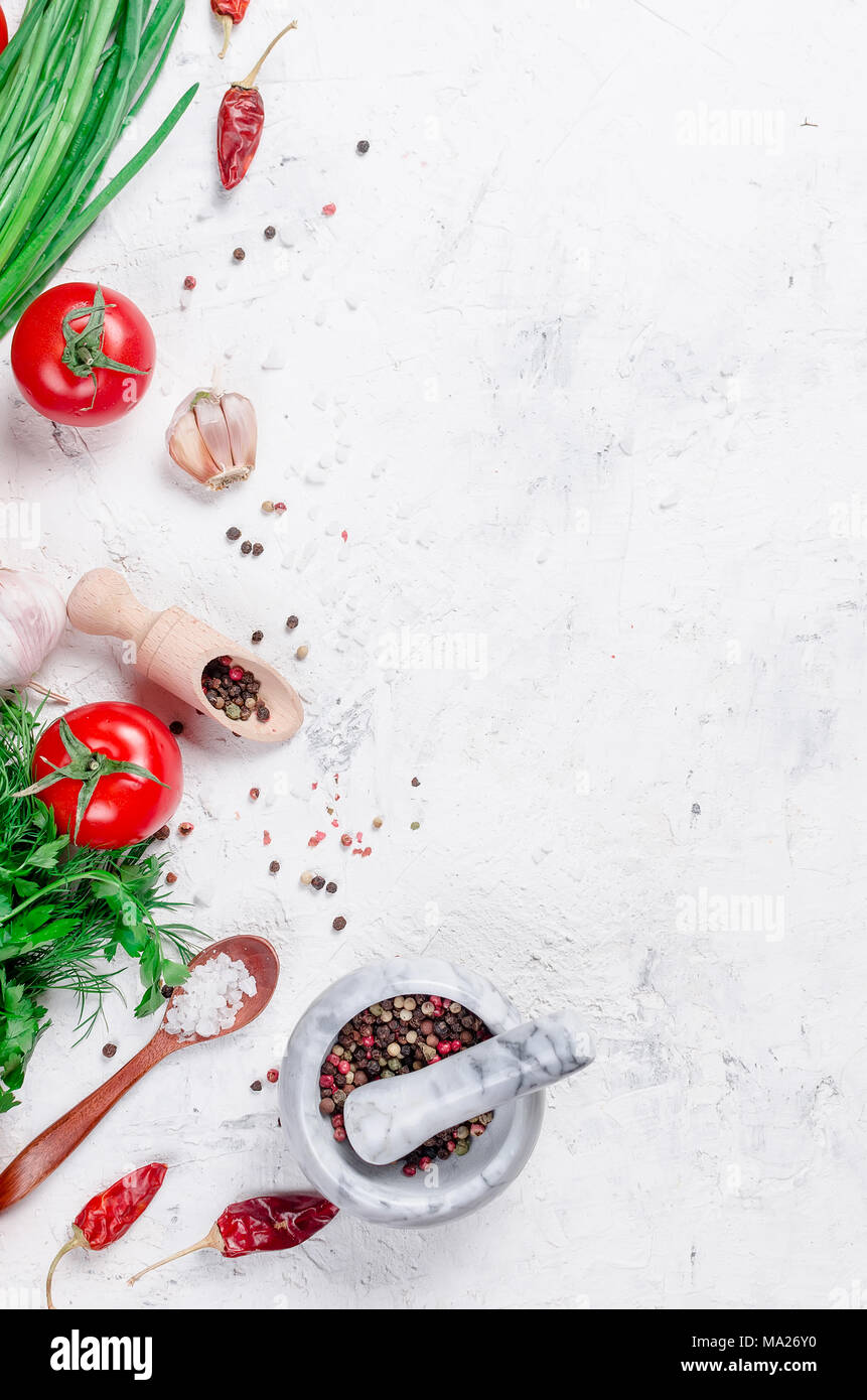 Ripe cherry tomato, green onion and parsley, garlic, solt in spoon and ...