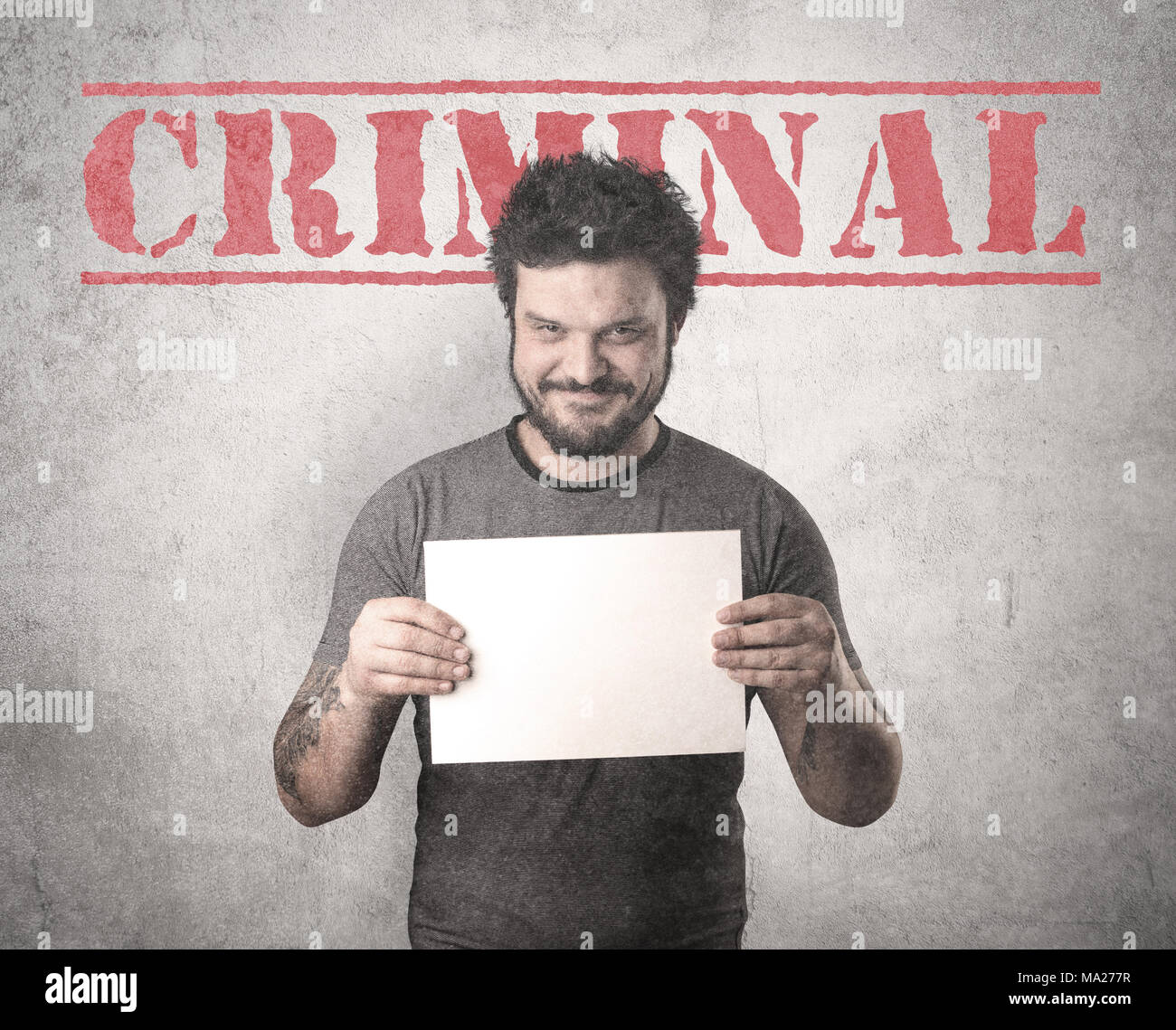 Caught gangster with criminal background Stock Photo - Alamy
