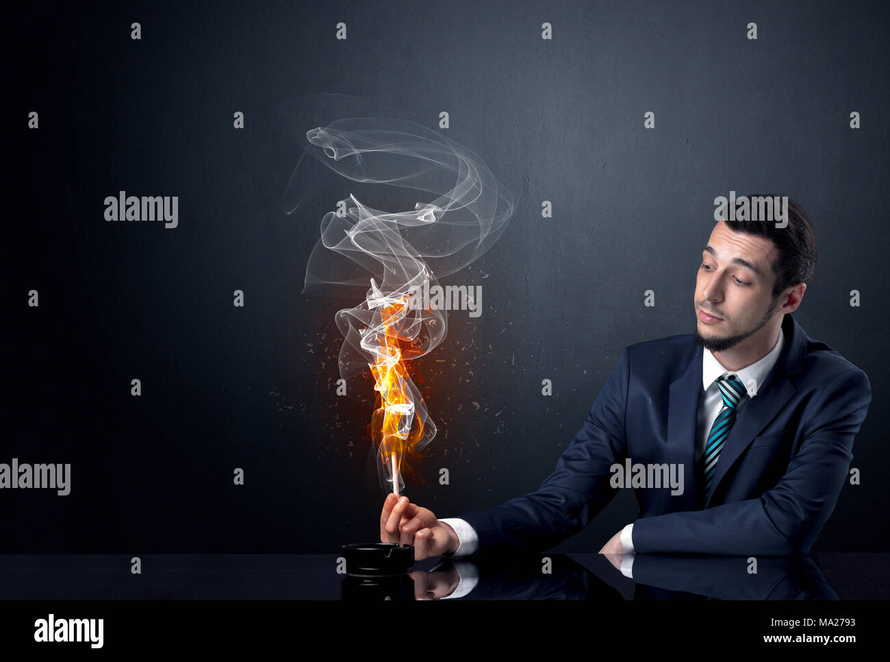 Businessman smoking with inferno effect Stock Photo - Alamy