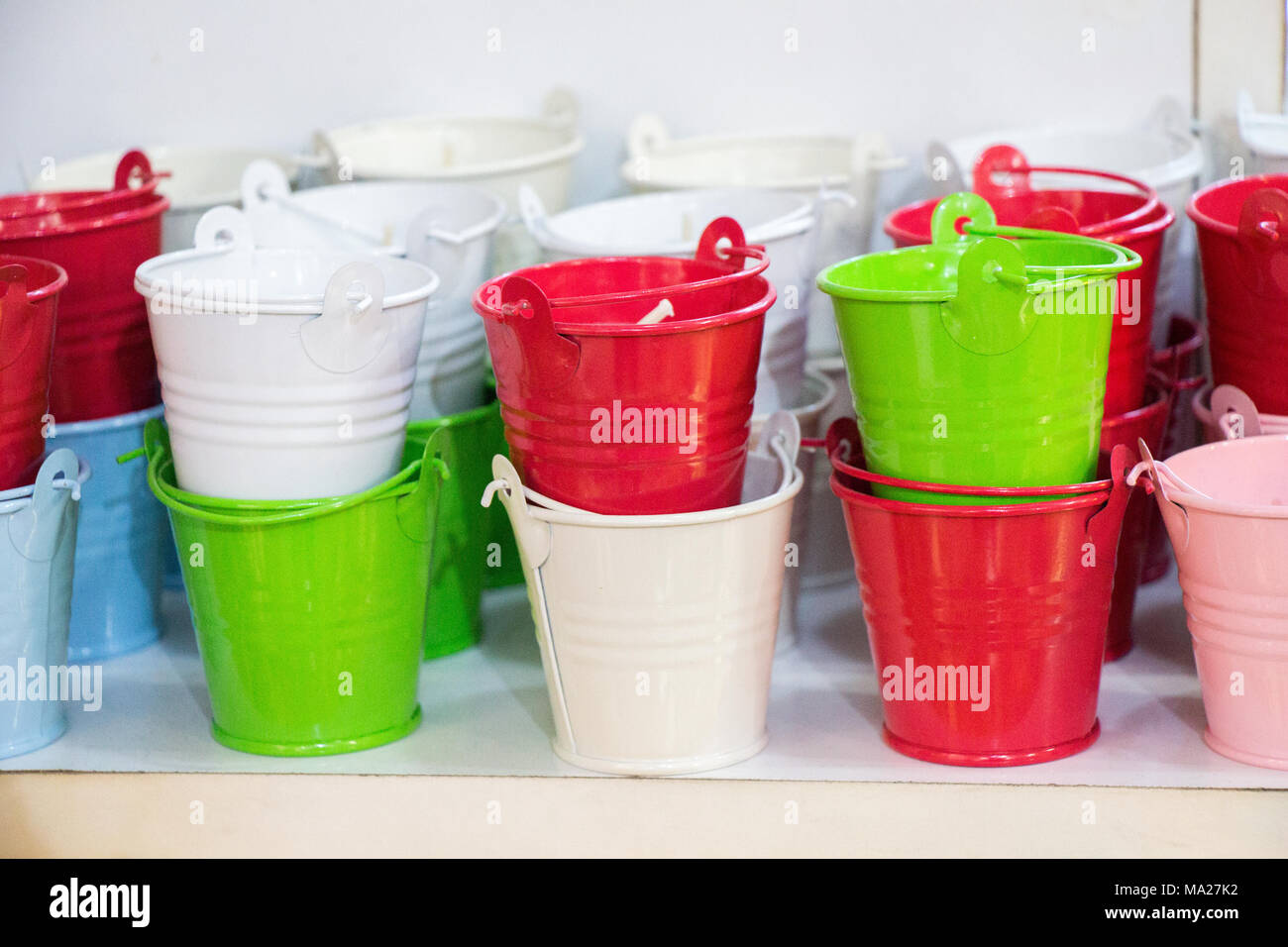 Little set of buckets of various colors in a market place Stock Photo ...