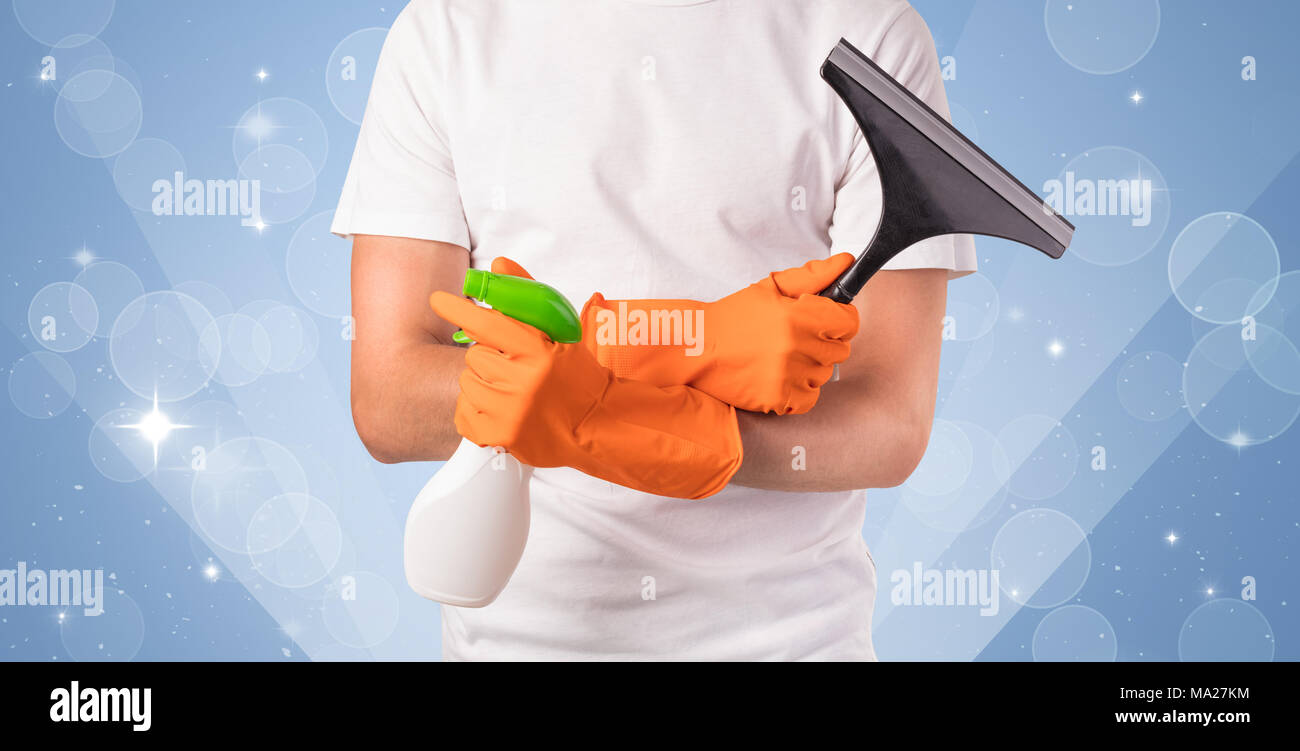 Glittered blue background with male housekeeper and cleaning equipment ...