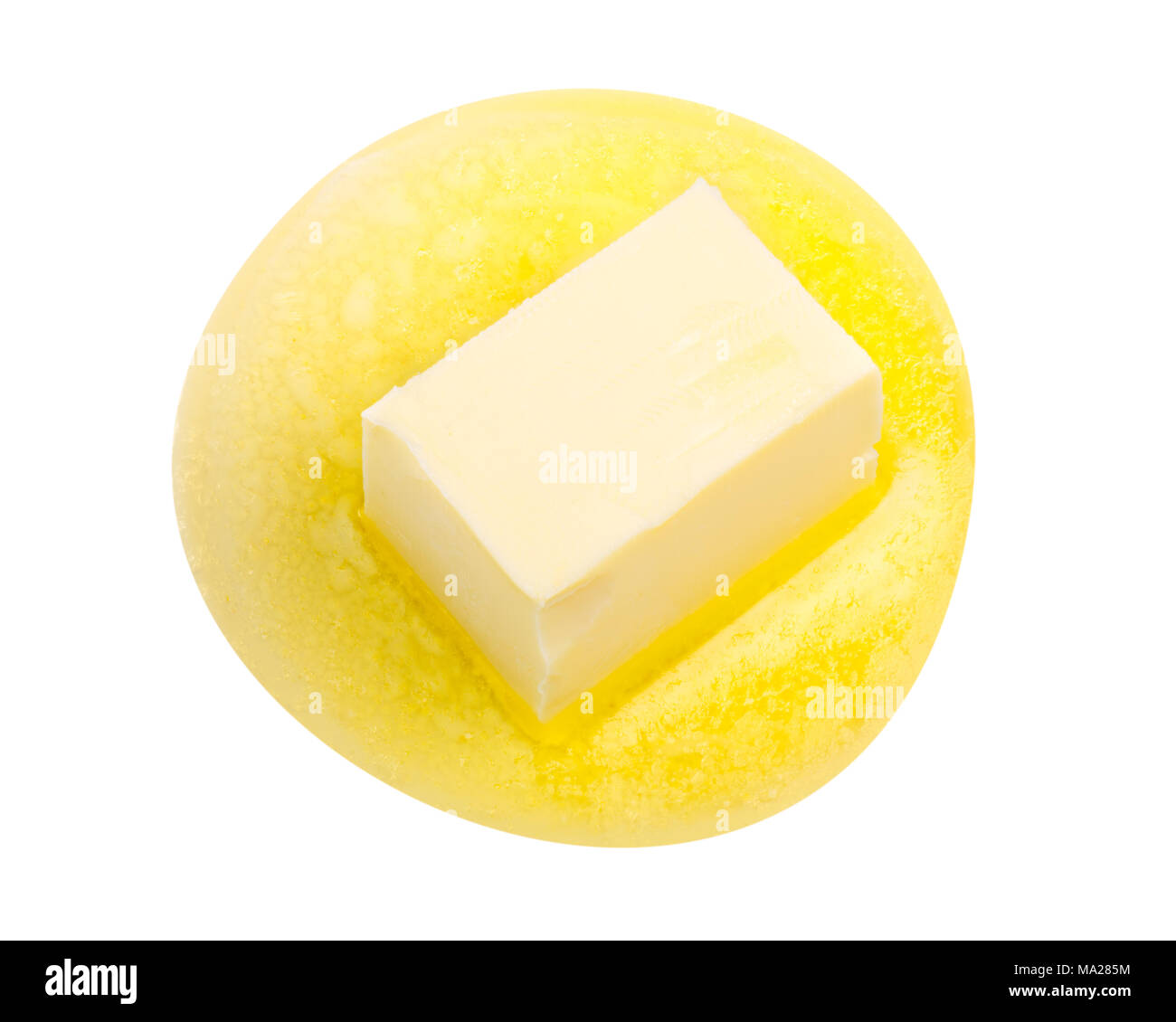 Melted butter with rectangular butter piece floating, top view Stock ...