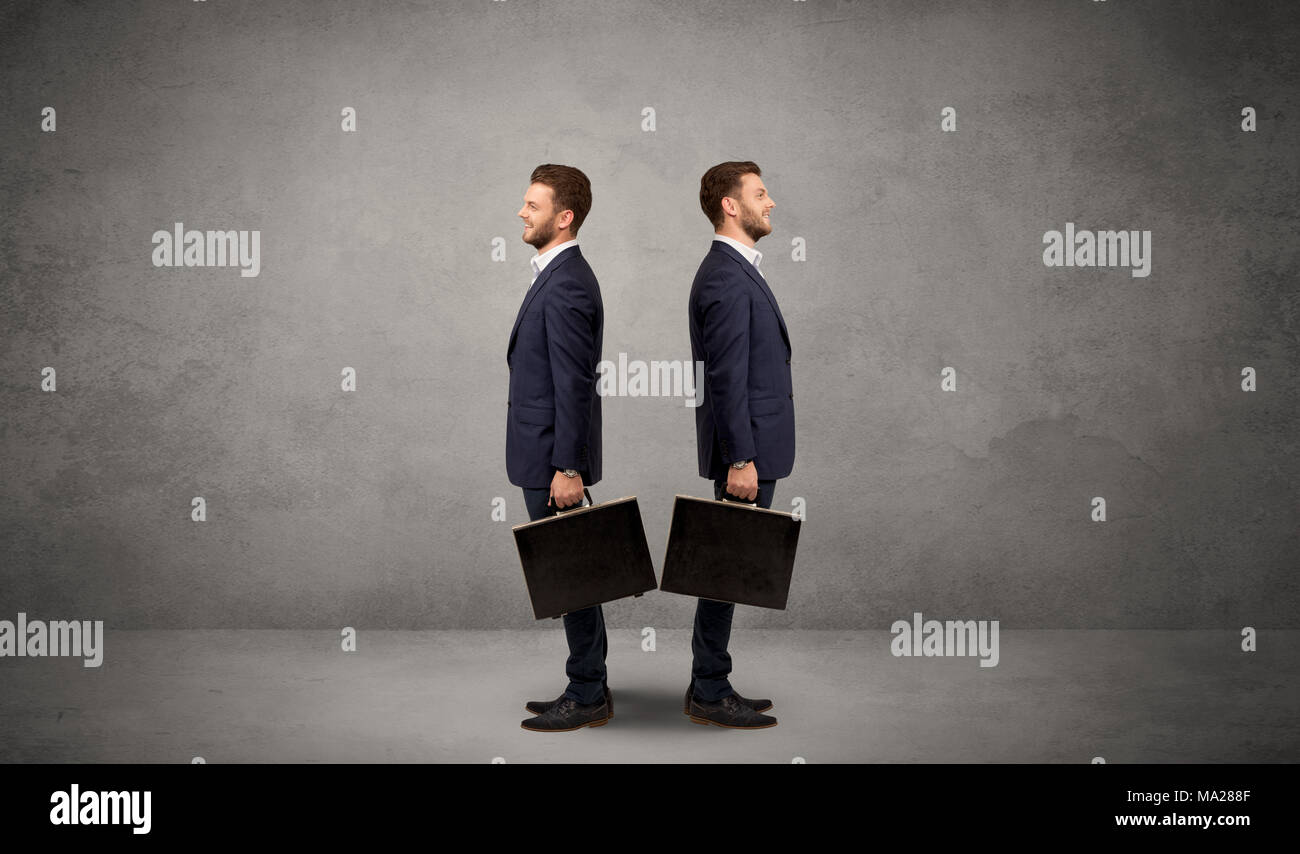 Young conflicted businessman choosing between two directions Stock ...
