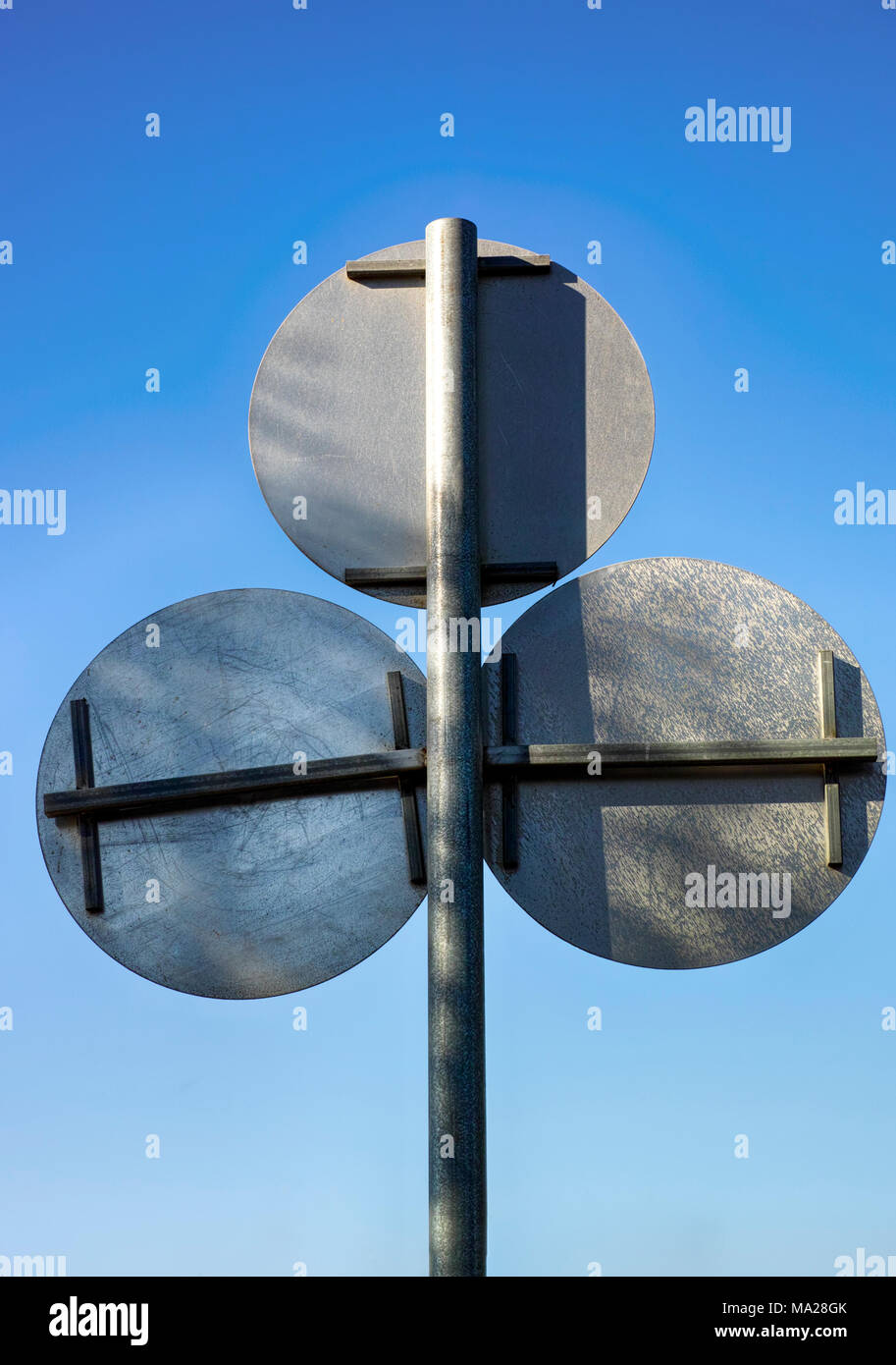 Back view of three road signs against blue sky Stock Photo - Alamy