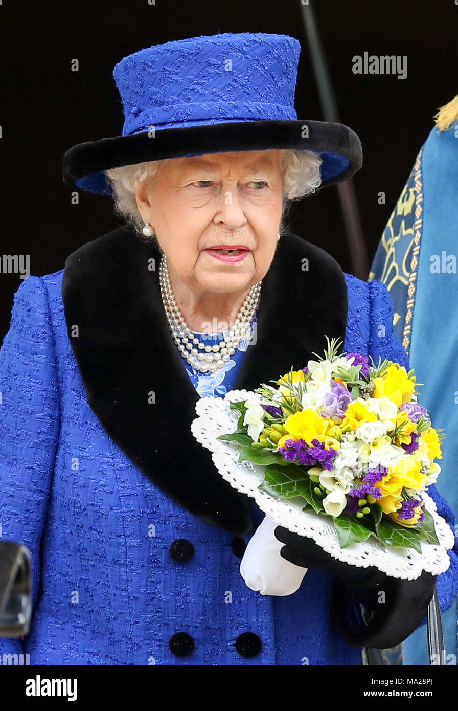 Queen Elizabeth II holding a nosegay outside St George's Chapel in ...