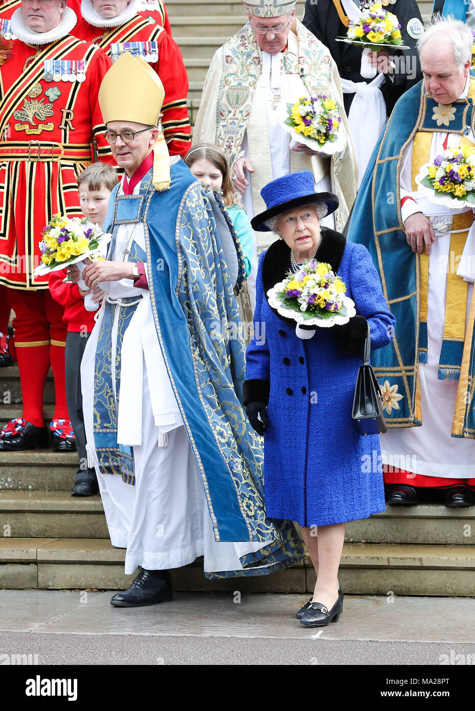 Queen Elizabeth II holding a nosegay outside St George's Chapel in ...