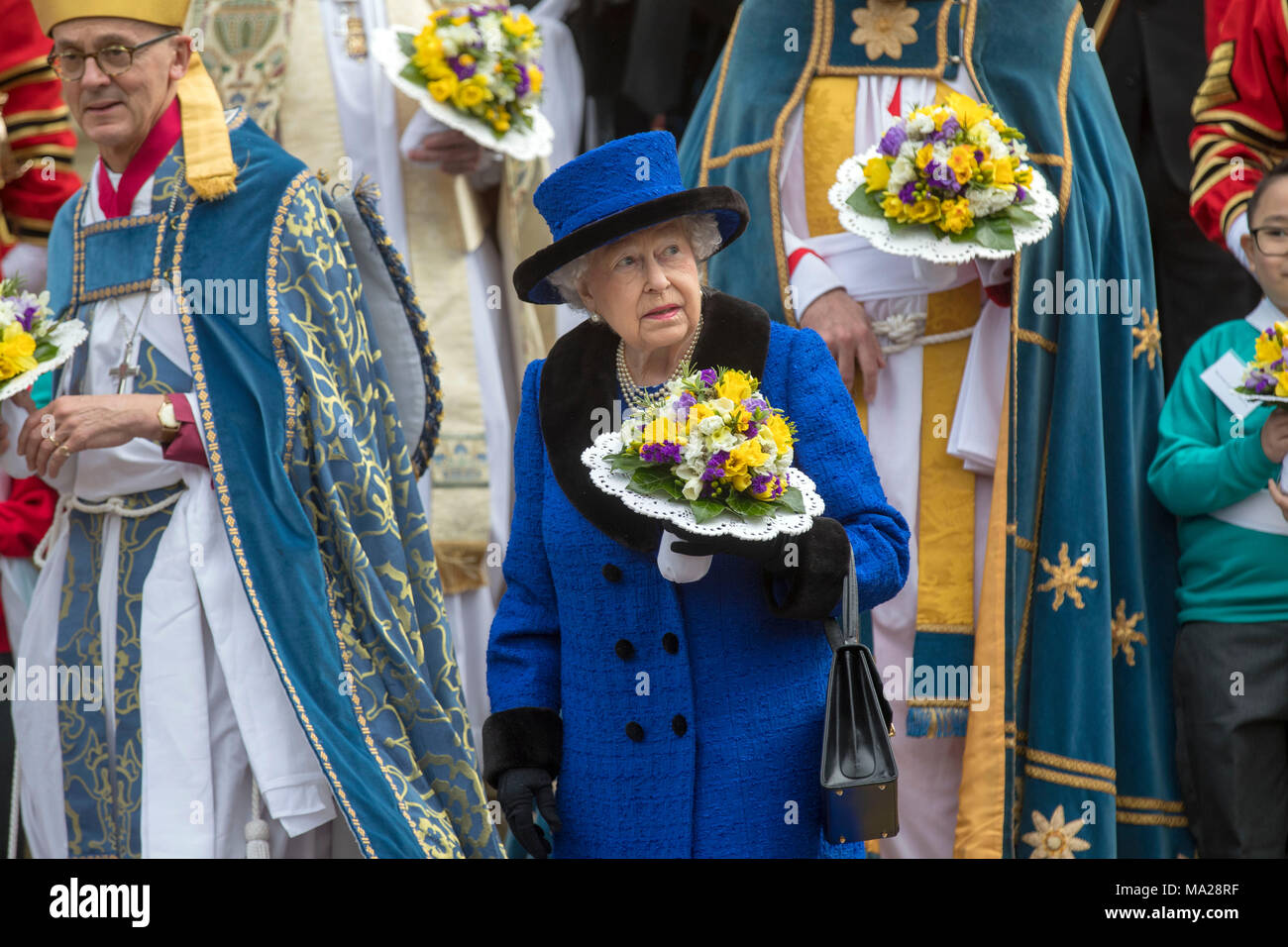 Queen Elizabeth II holding a nosegay outside St George's Chapel in ...