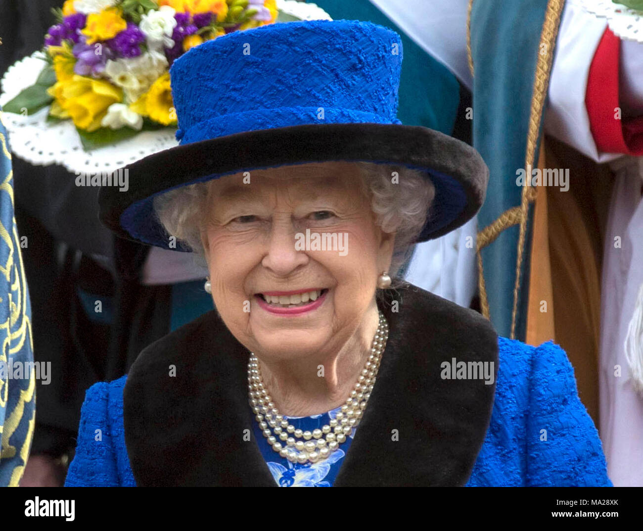 Queen Elizabeth II holding a nosegay outside St George's Chapel in ...