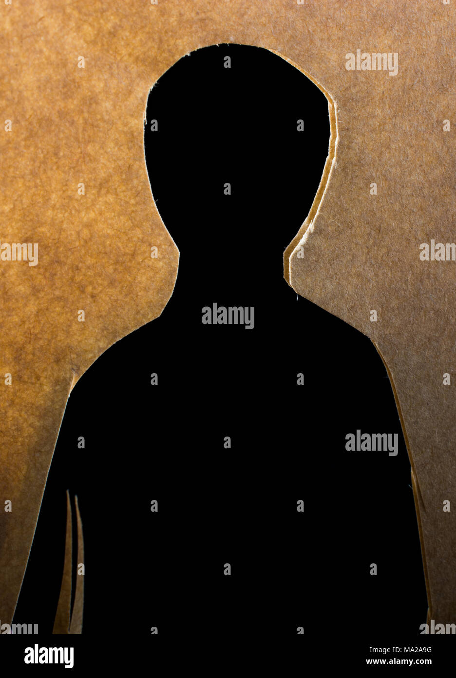 Man shape cut out of paper in hand in the view Stock Photo - Alamy