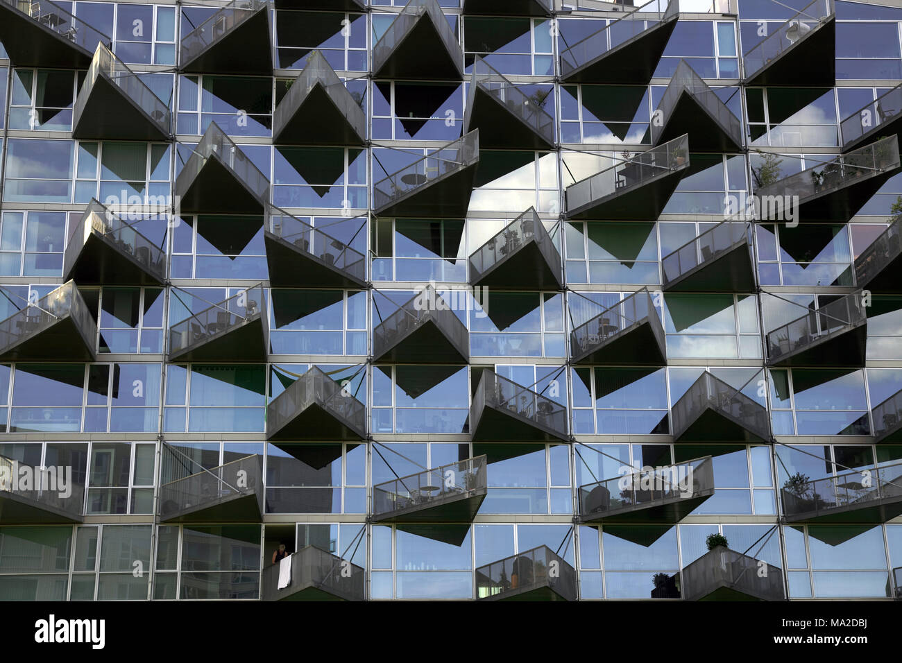 Glass facade of VM-house with triangular balconies in Copenhagen ...