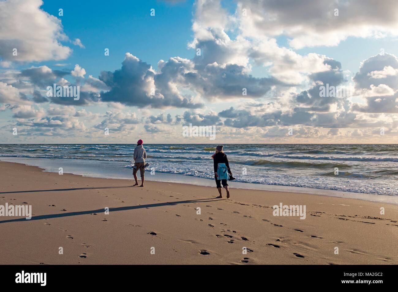 Two people walking along the beach near Kampen, Sylt Stock Photo - Alamy