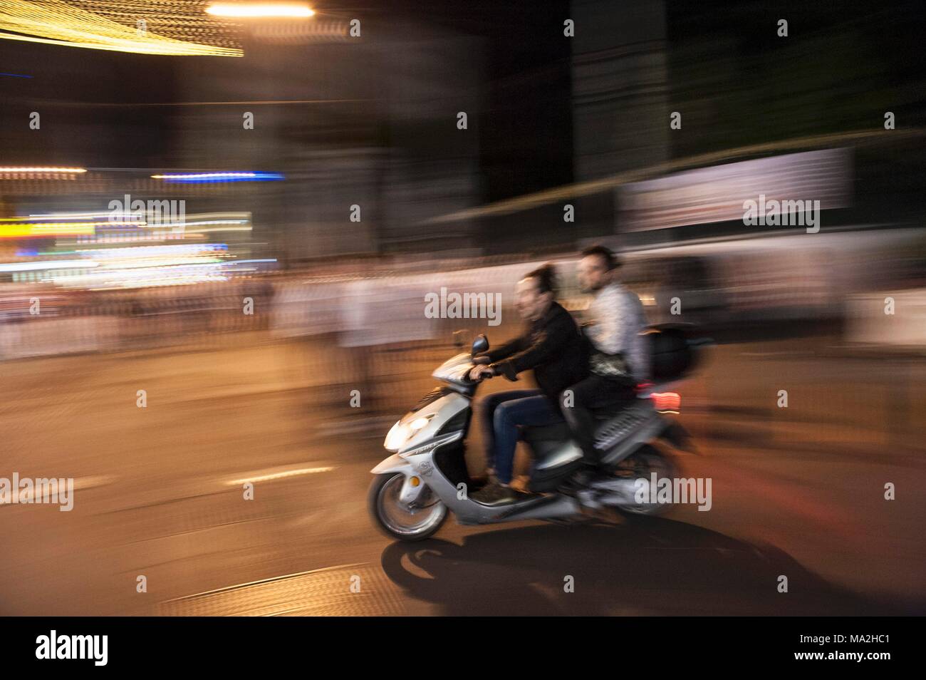 Two people on moped hi-res stock photography and images - Alamy