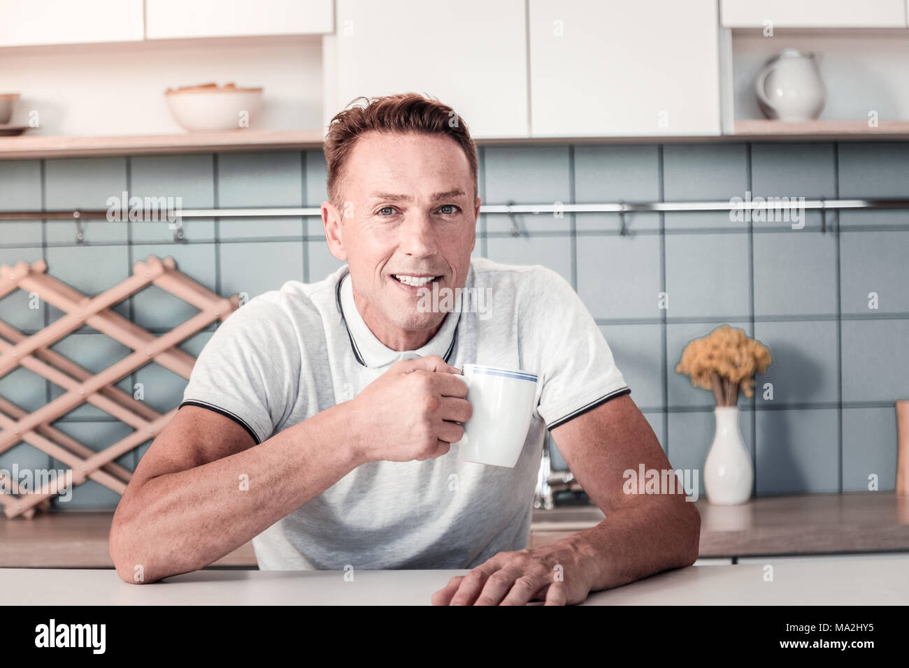 Positive delighted man having break Stock Photo - Alamy Positive delighted man having break Stock Photo - Alamy