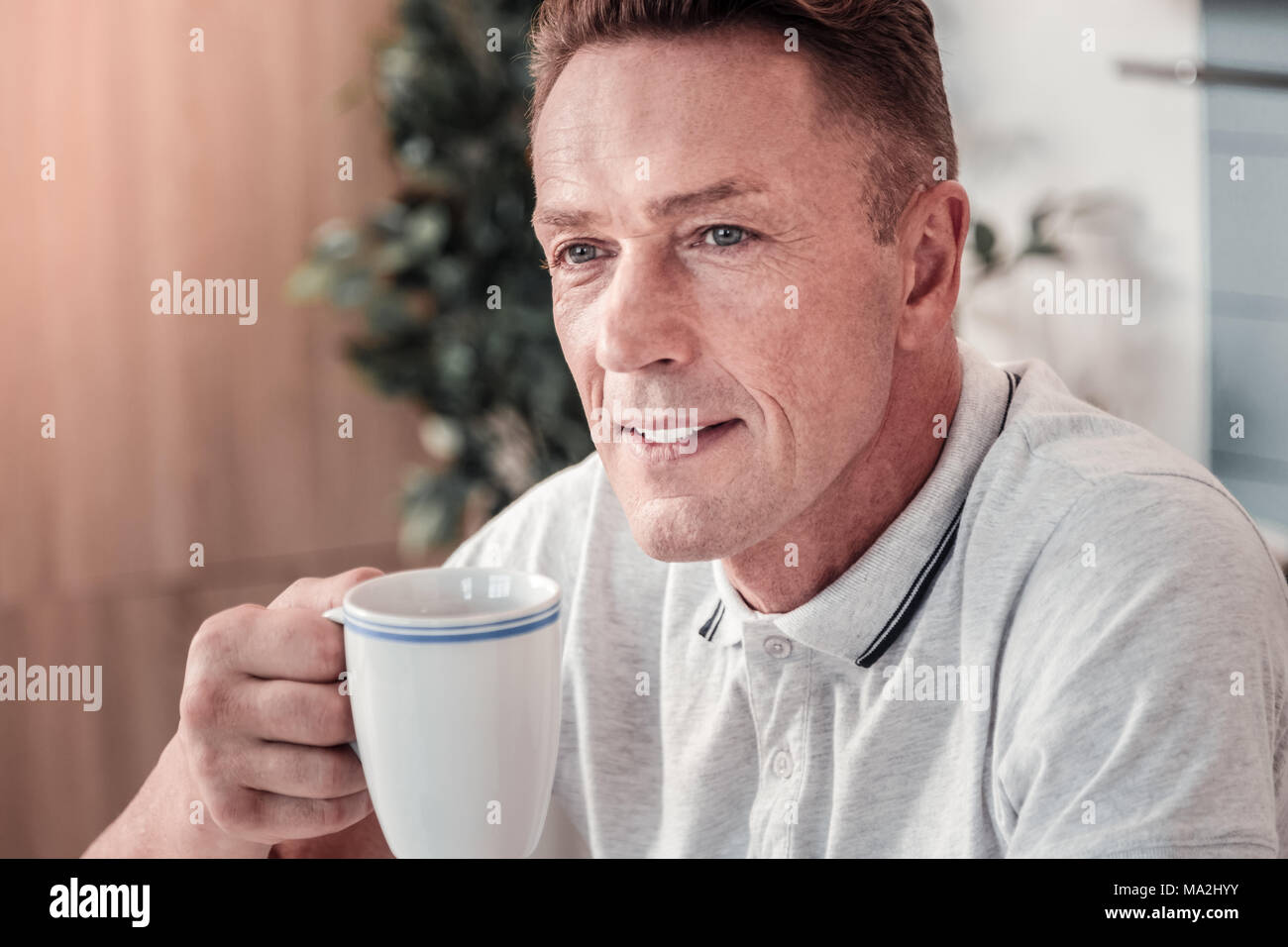 Portrait of delighted man that enjoying his morning Stock Photo - Alamy