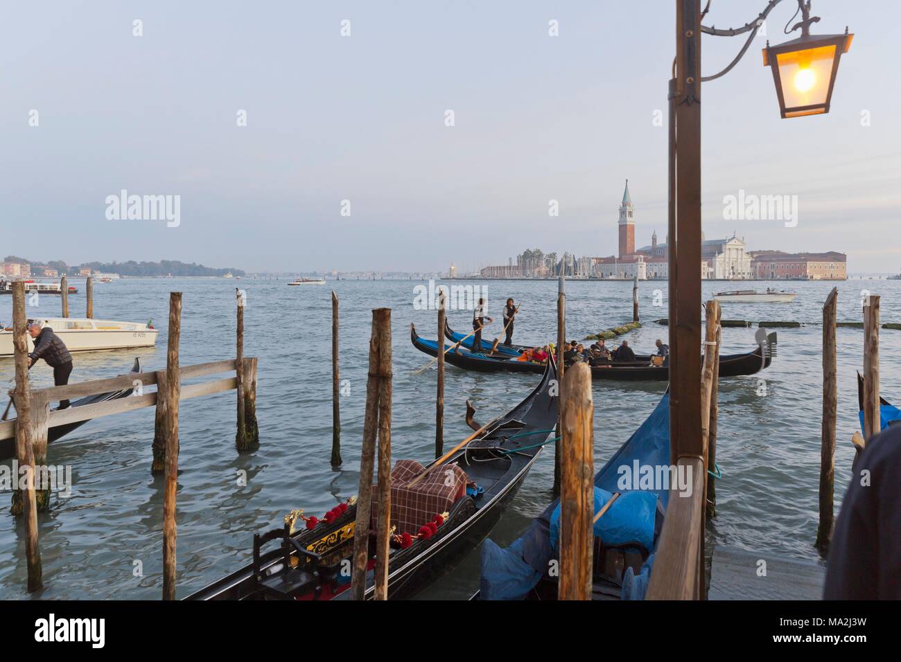 Gondolas and gondoliers, Venice, Italy Stock Photo - Alamy