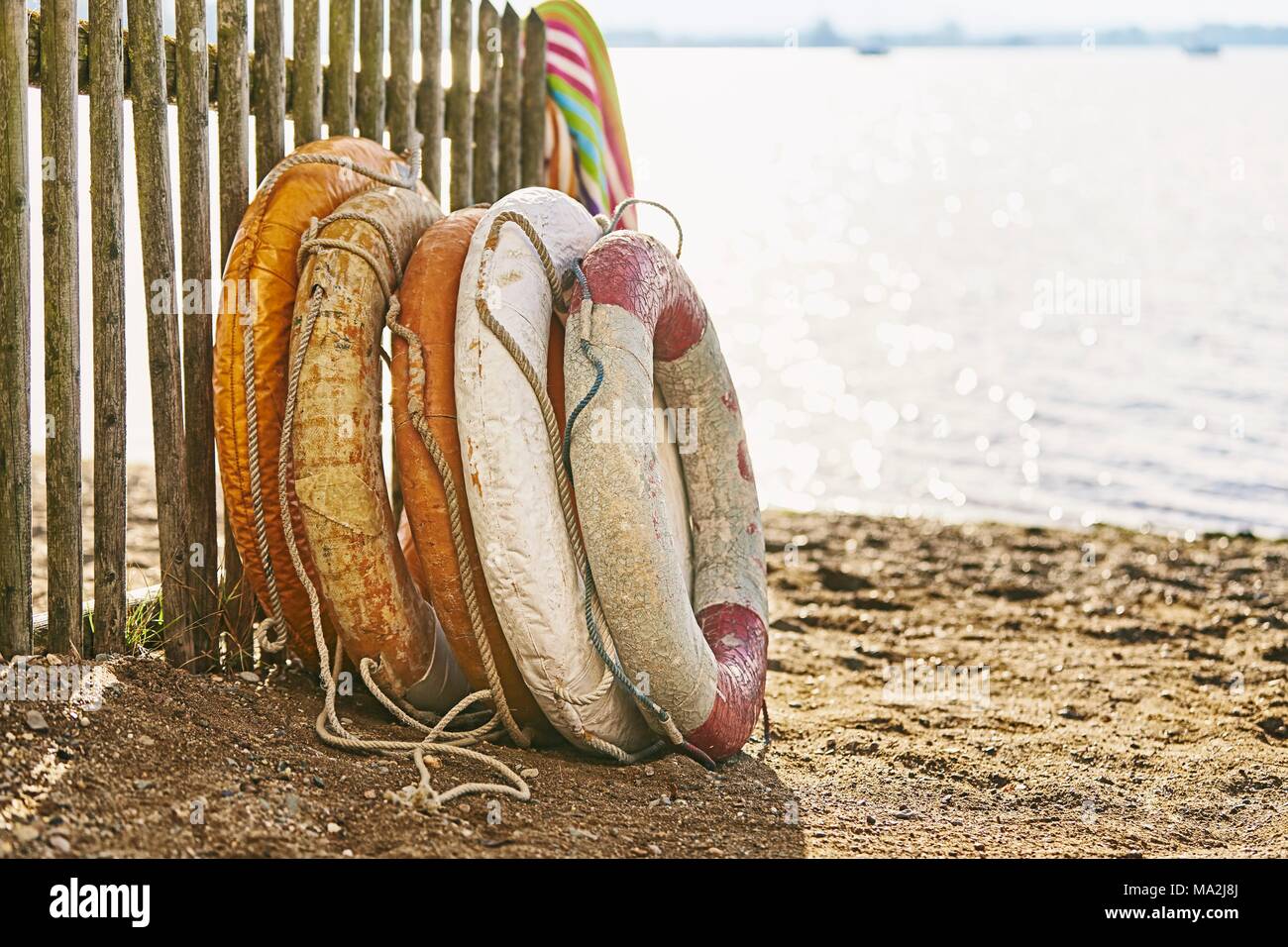 Life rings by a lake Stock Photo - Alamy