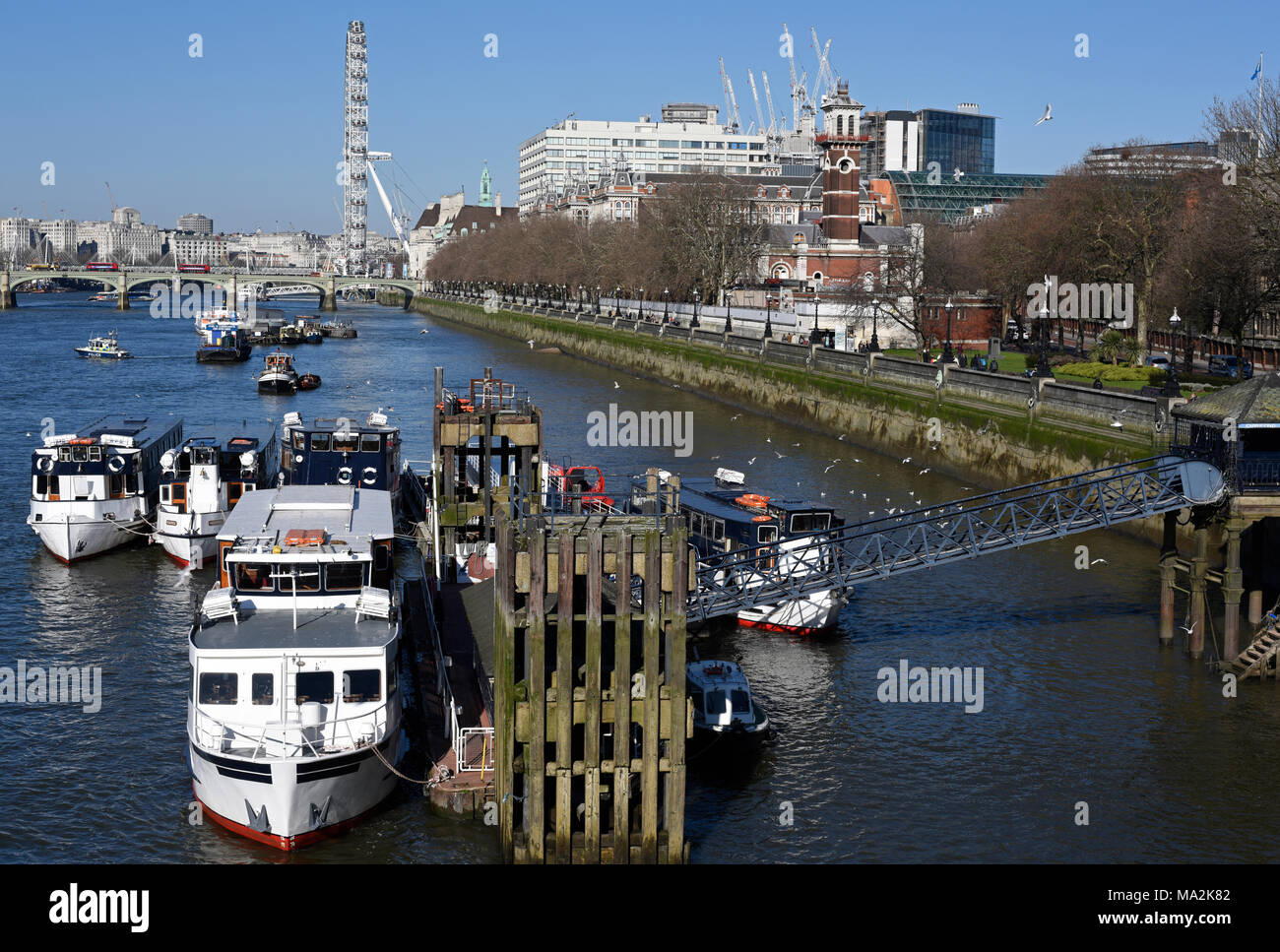 Boats moored on the River Thames in front of Westminster Bridge, The ...
