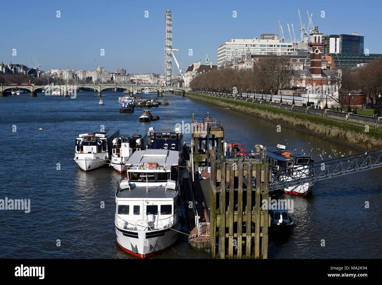 Boats moored on the River Thames in front of Westminster Bridge, The ...